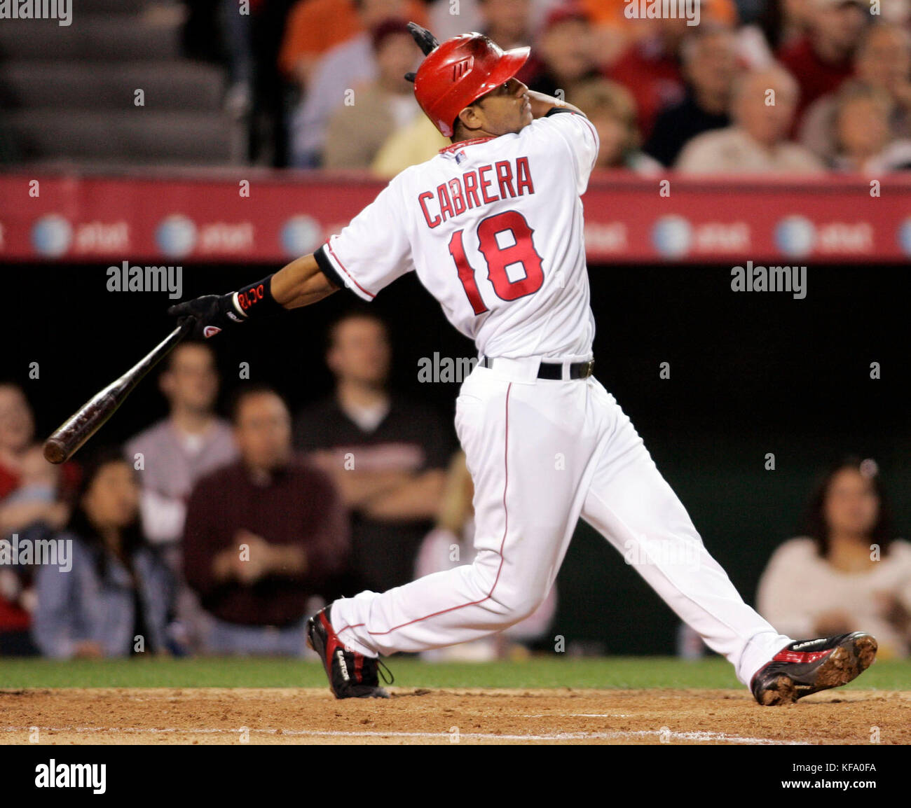 Los Angeles Angels' Orlando Cabrera hits a RBI single off Texas Rangers ...