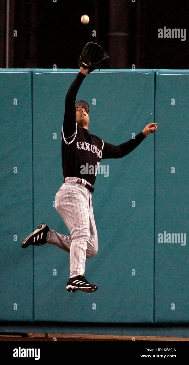 Colorado Rockies center fielder Cory Sullivan makes a leaping catch at ...