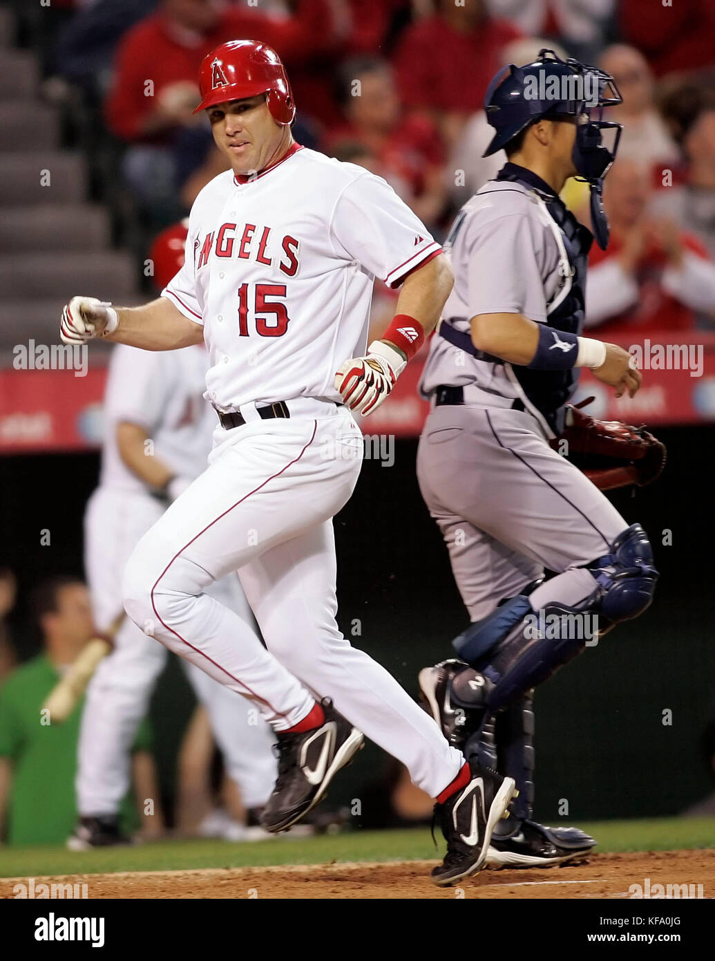 Los Angeles Angels' Tim Salmon, left, scores on a single by teammate ...