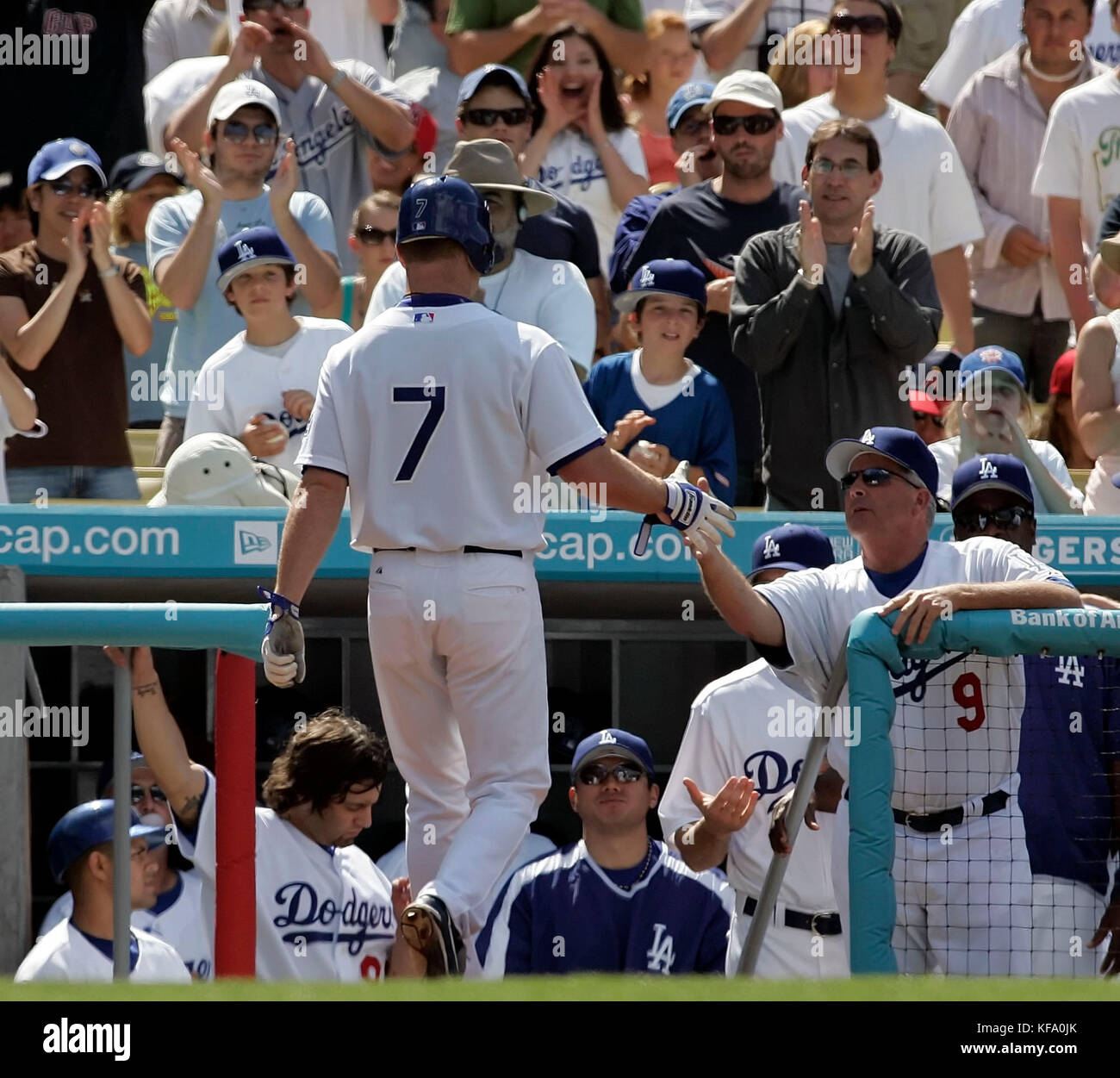 Los Angeles Dodgers' J.D. Drew (7) is greeted in the dugout by manager ...