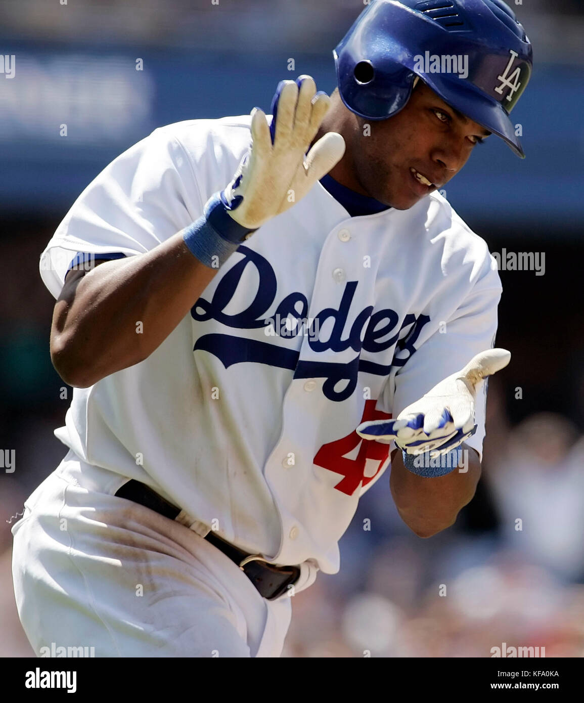 Los Angeles Dodgers' Willy Aybar claps his hands while rounding first ...