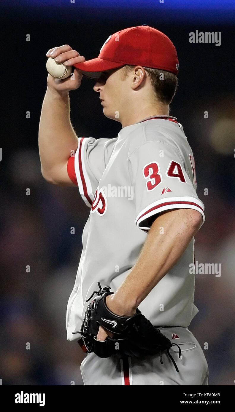 Philadelphia Phillies pitcher Gavin Floyd holds the bill of his cap ...