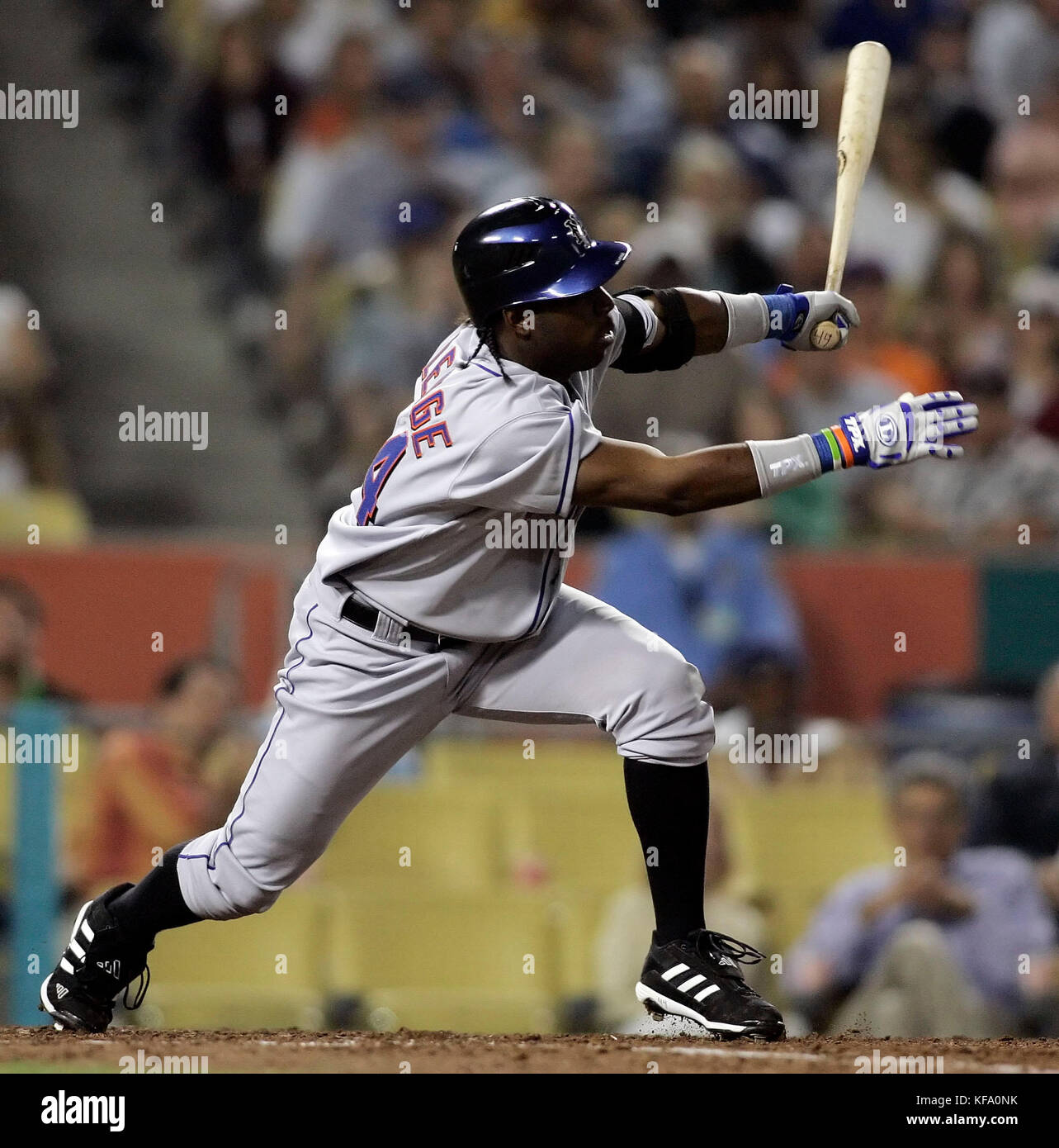New York Mets' Lastings Milledge follows through on an RBI-single off ...