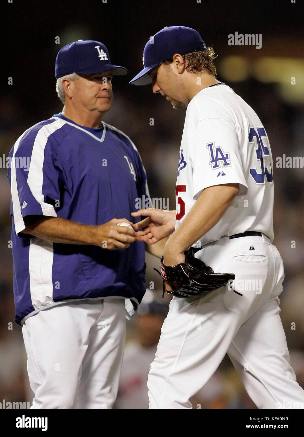 Los Angeles Dodgers pitcher Brett Tomko, right, hands the ball to ...