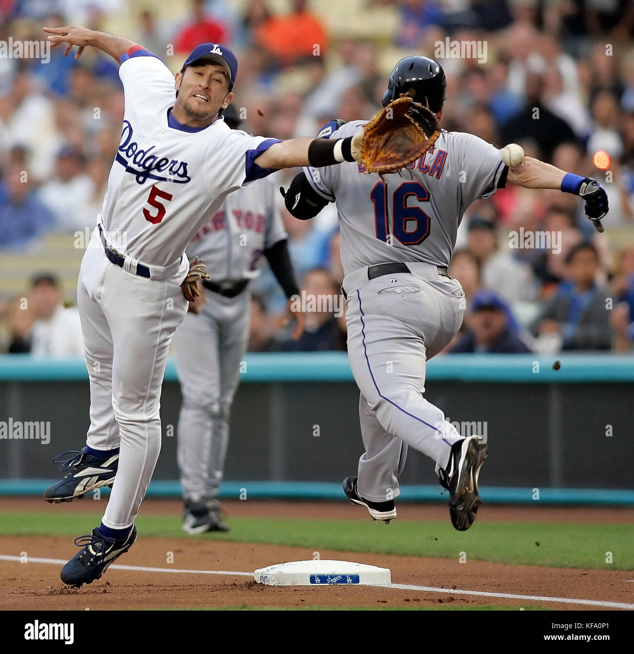 Los Angeles Dodgers first baseman Nomar Garciaparra, left, dives for a ...