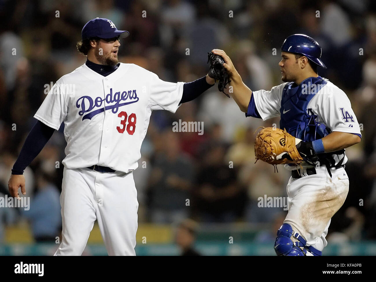 Los Angeles Dodgers relief pitcher Eric Gagne, left is congratulated by ...