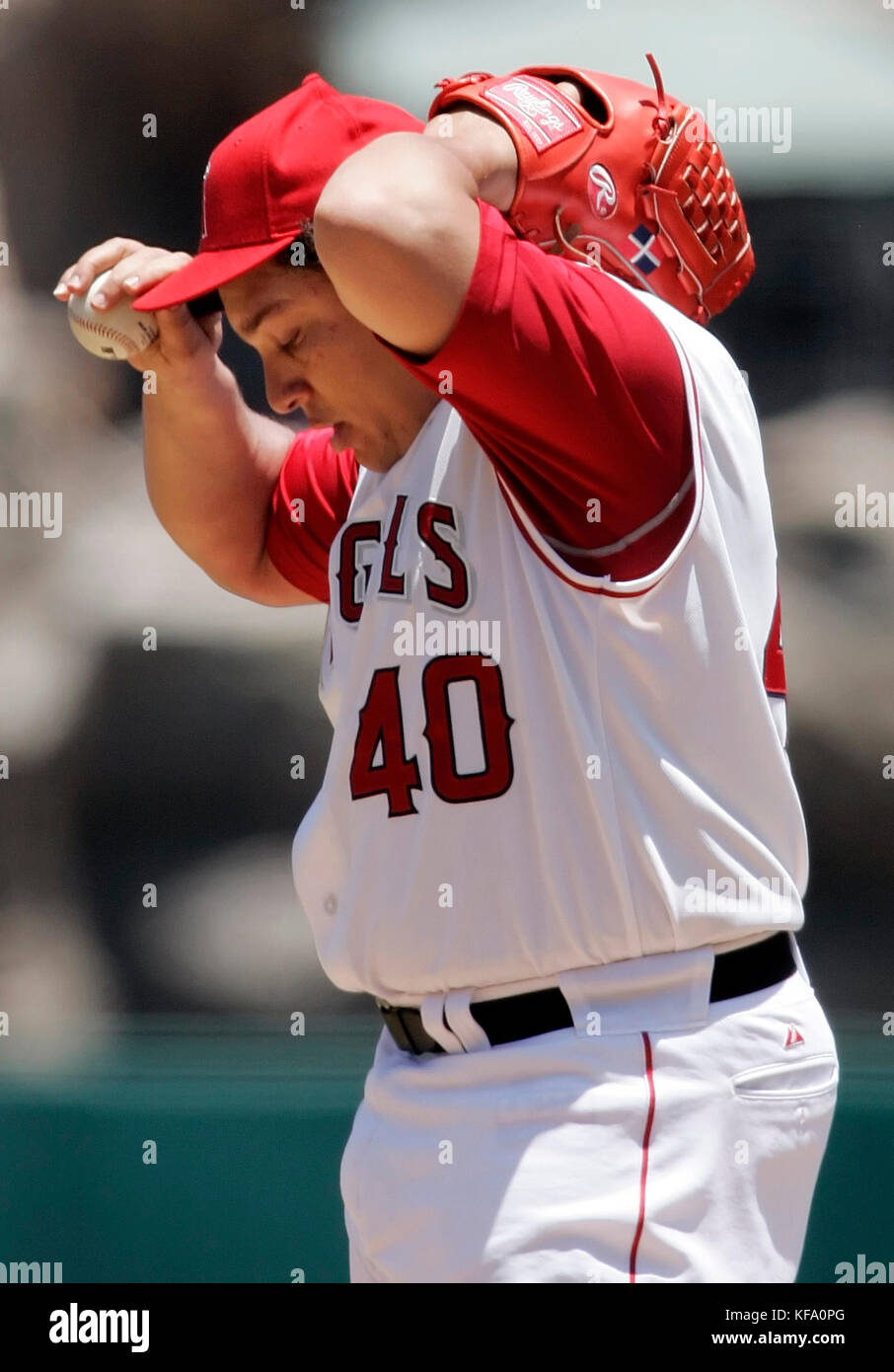Los Angeles Angels pitcher Bartolo Colon adjusts the bill of his cap ...