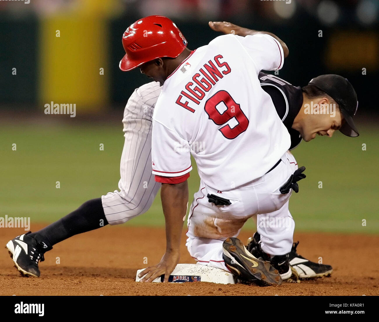 Los Angeles Angels' Chone Figgins (9) is tagged out at second base by ...