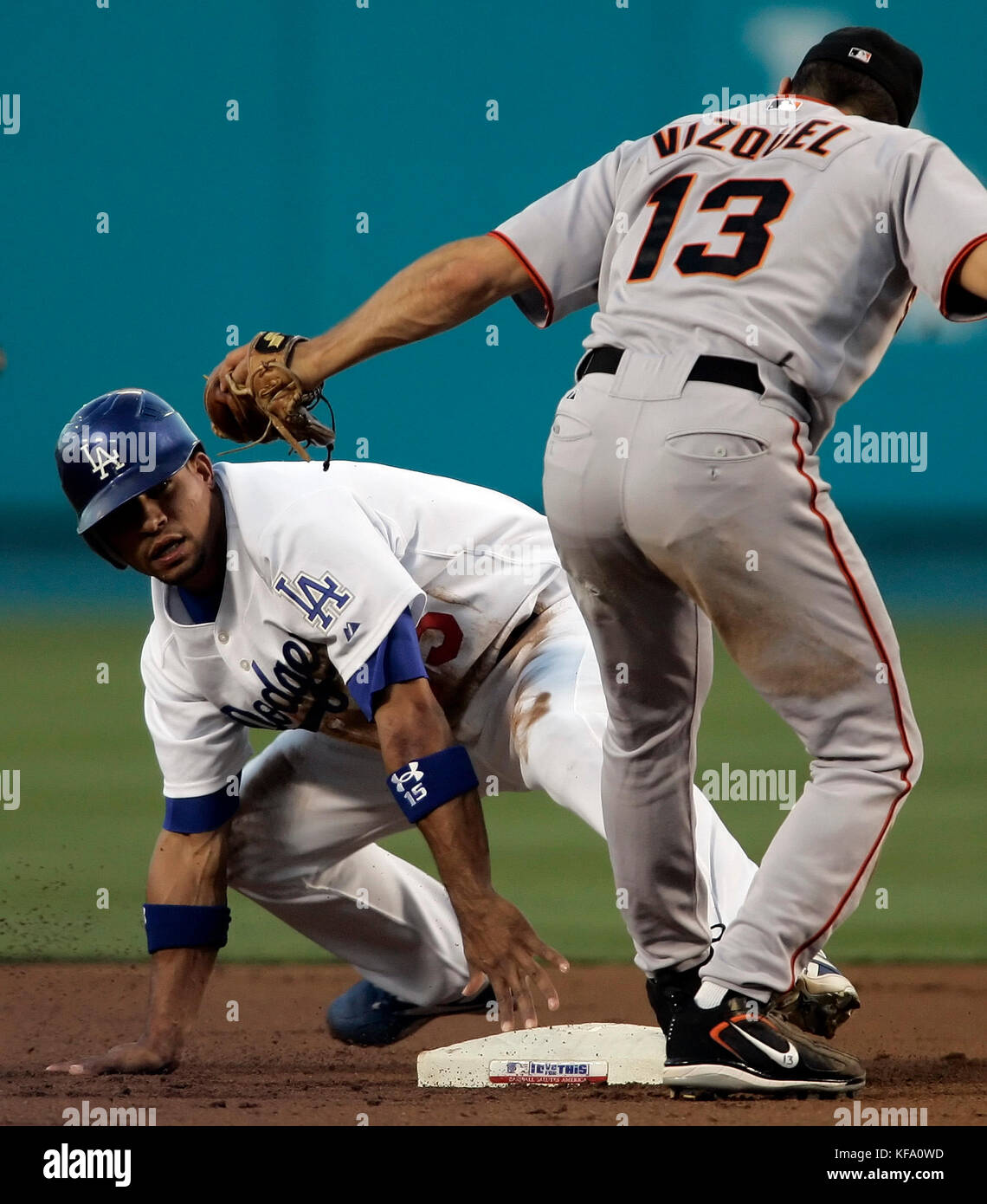 Los Angeles Dodgers' Rafael Furcal, left, slides safely under the tag ...