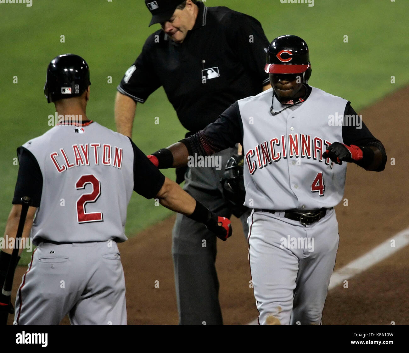 Cincinnati Reds' Brandon Phillips, right, is greeted at home plate by ...
