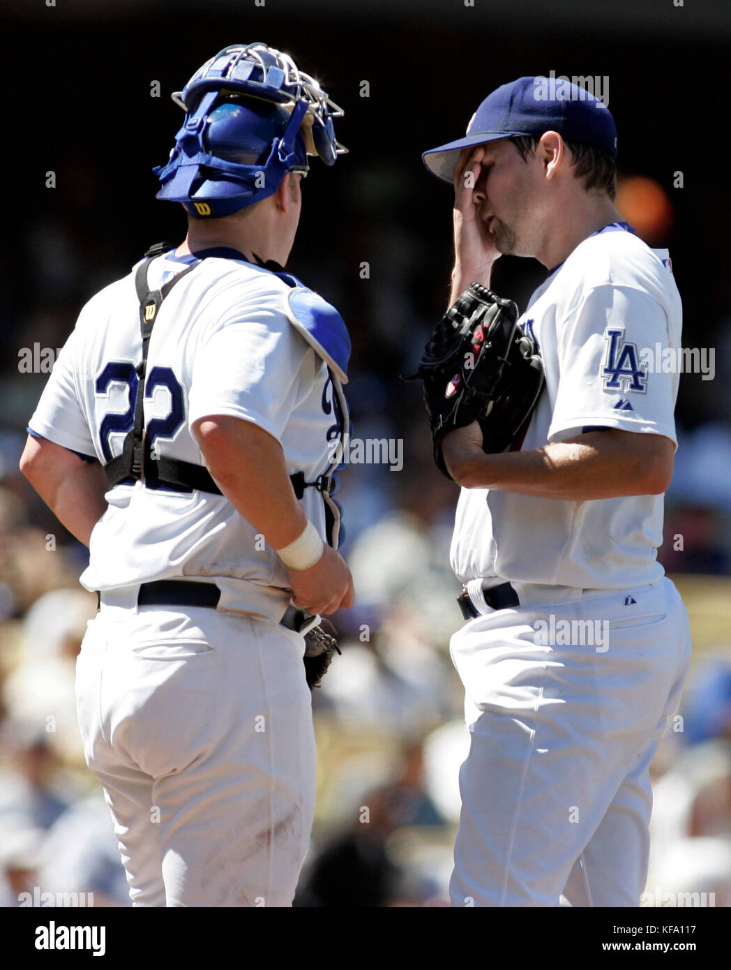 Los Angeles Dodgers pitcher Aaron Sele, right, wipes his face during a ...