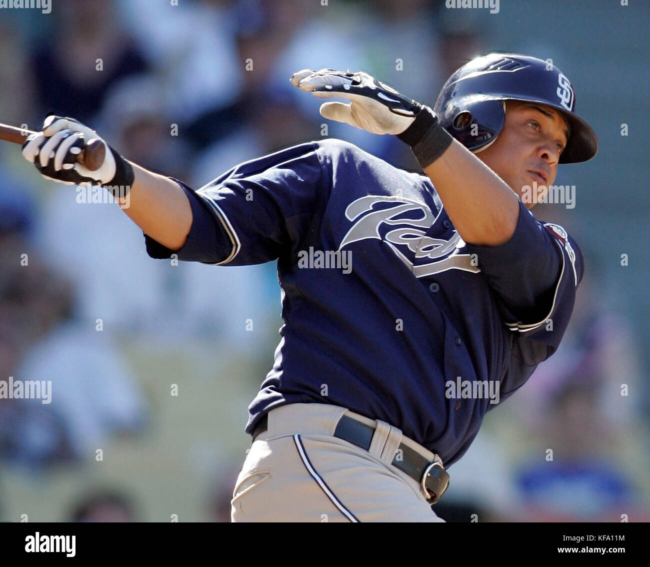 San Diego Padres' Terrmel Sledge watches his RBI single off Los Angeles ...