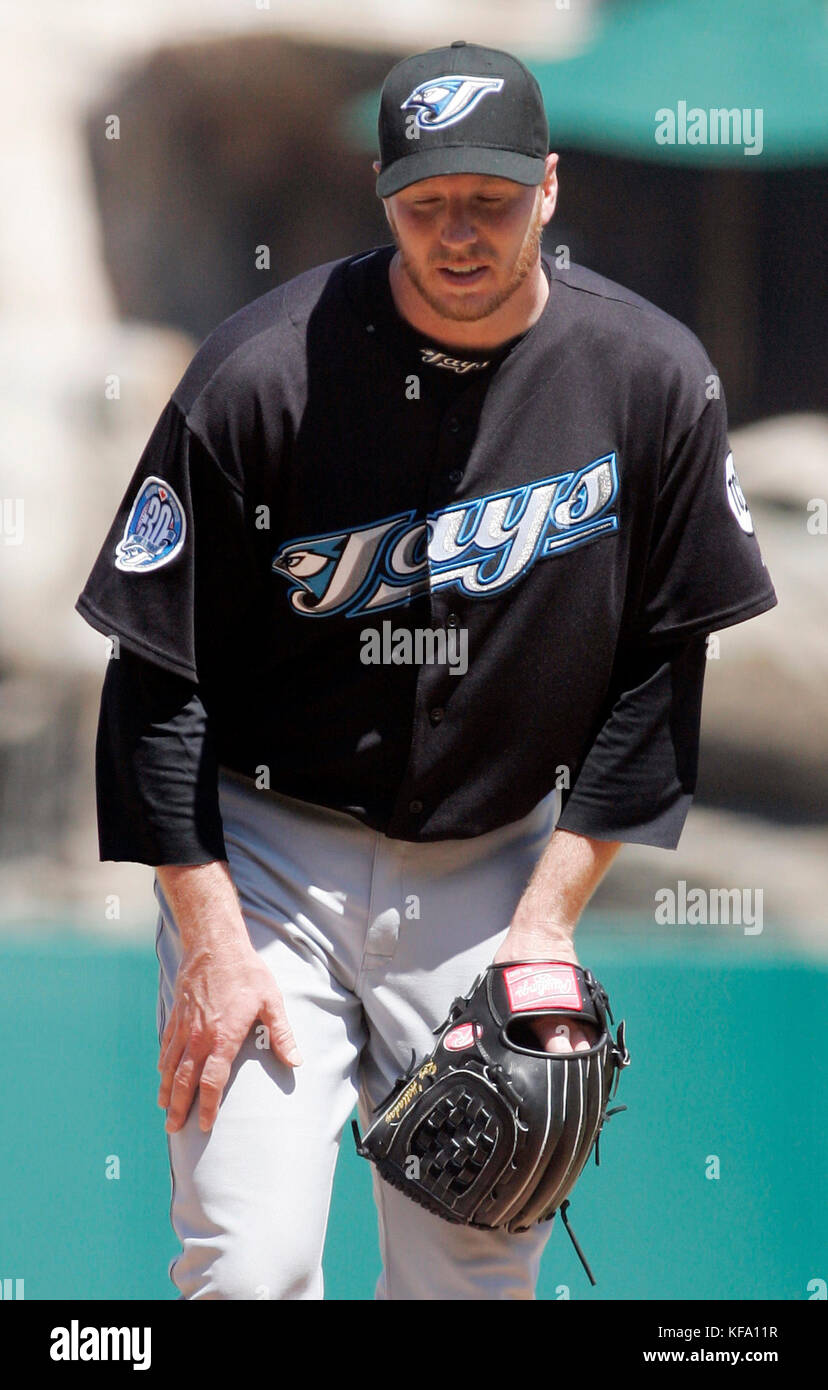 Toronto Blue Jays pitcher Roy Halladay grimaces after hit by a line ...
