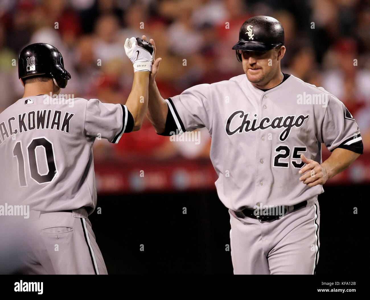 Chicago White Sox's Jim Thome, right, is greeted by teammate Rob ...