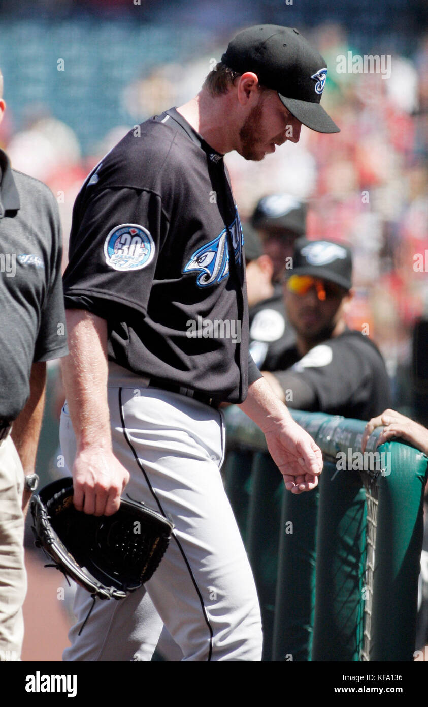 Toronto Blue Jays pitcher Roy Halladay walks off the field and leaves ...