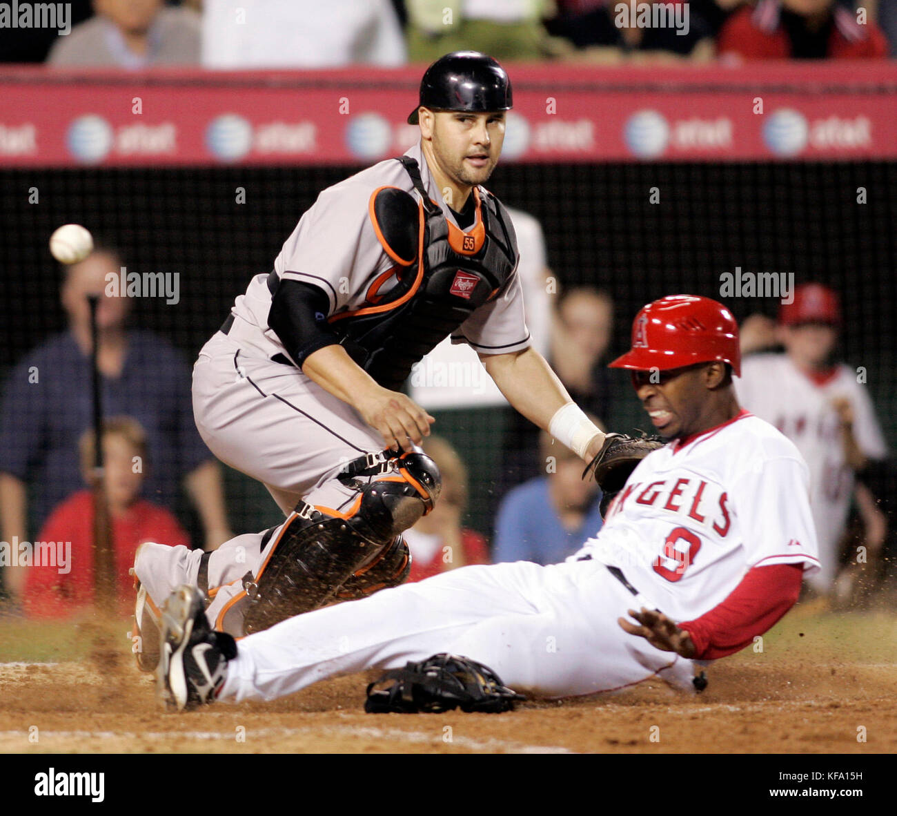 Los Angeles Angels' Chone Figgins, right, slides safely into home ...