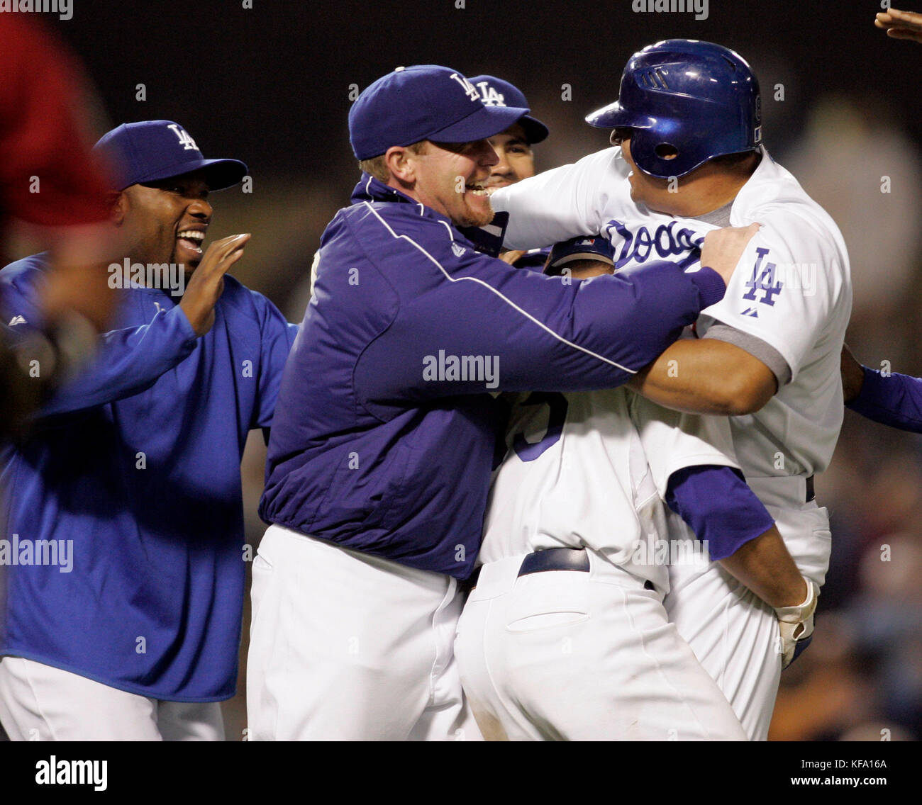 Los Angeles Dodgers' Olmedo Saenz, right, is mobbed by teammates after ...
