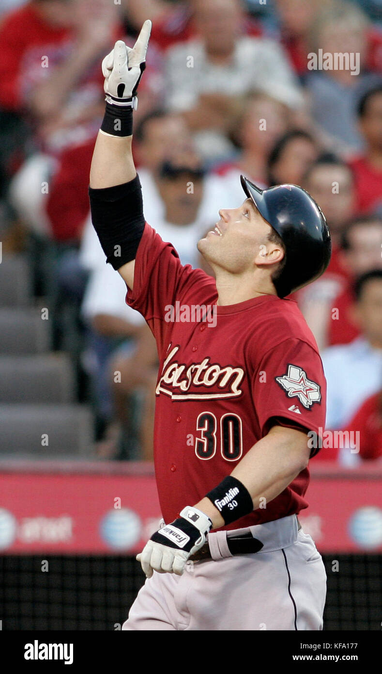 Houston Astros' Luke Scott points skyward while crossing home plate ...