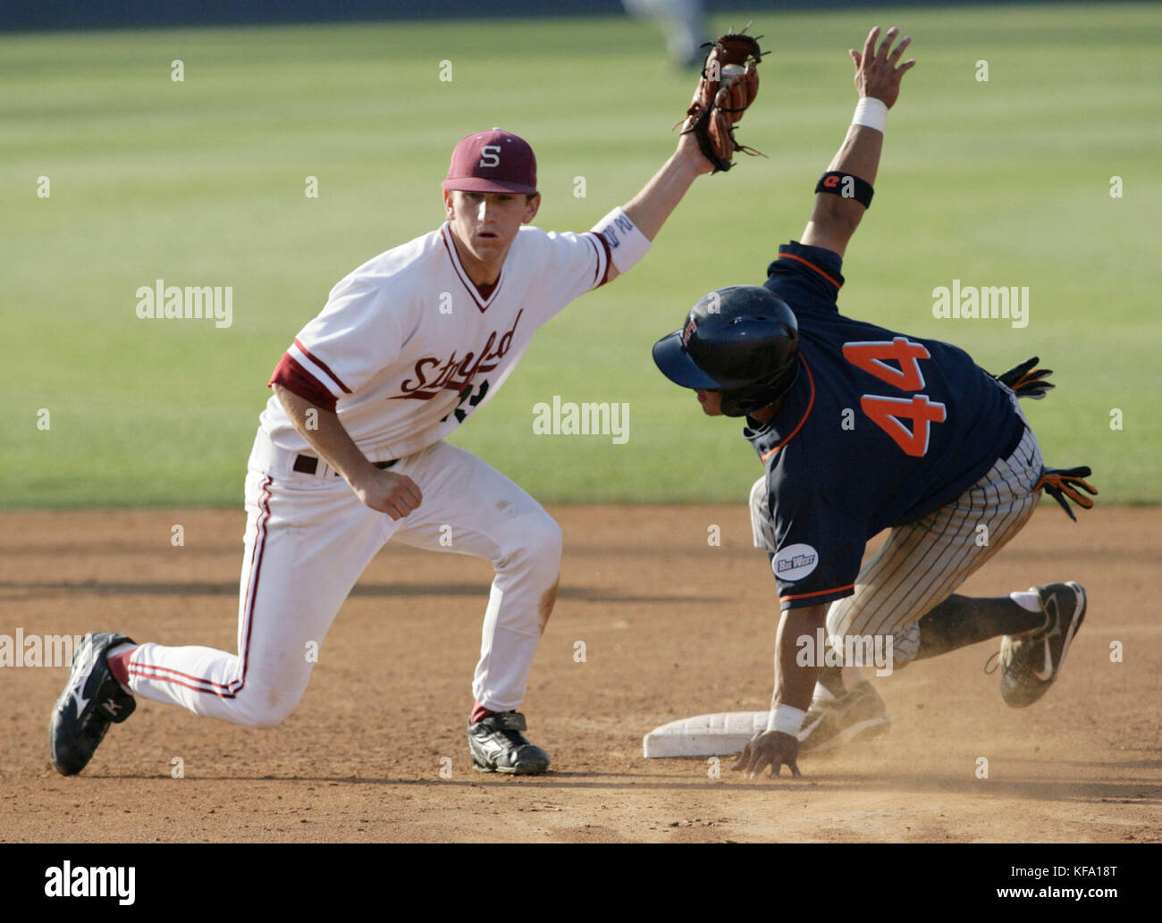 Stanford short stop Colin Walsh, left, applies a late tag on Cal State ...