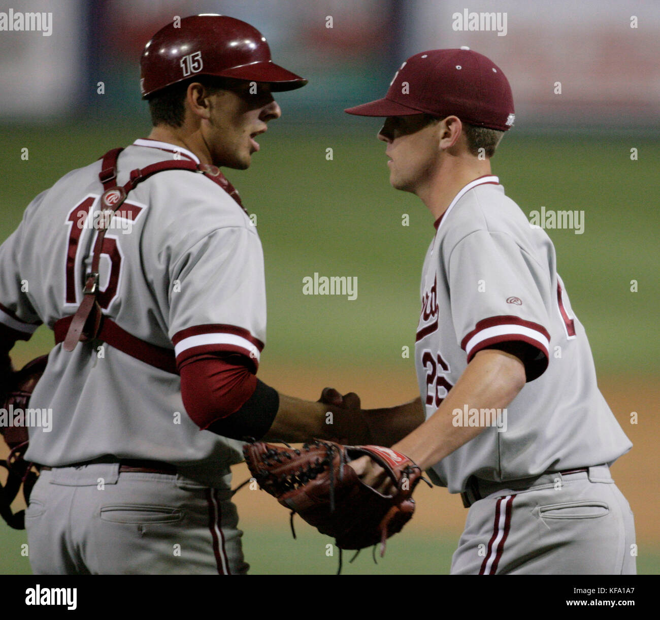 Stanford relief pitcher Drew Storen, right, gets a handshake from ...