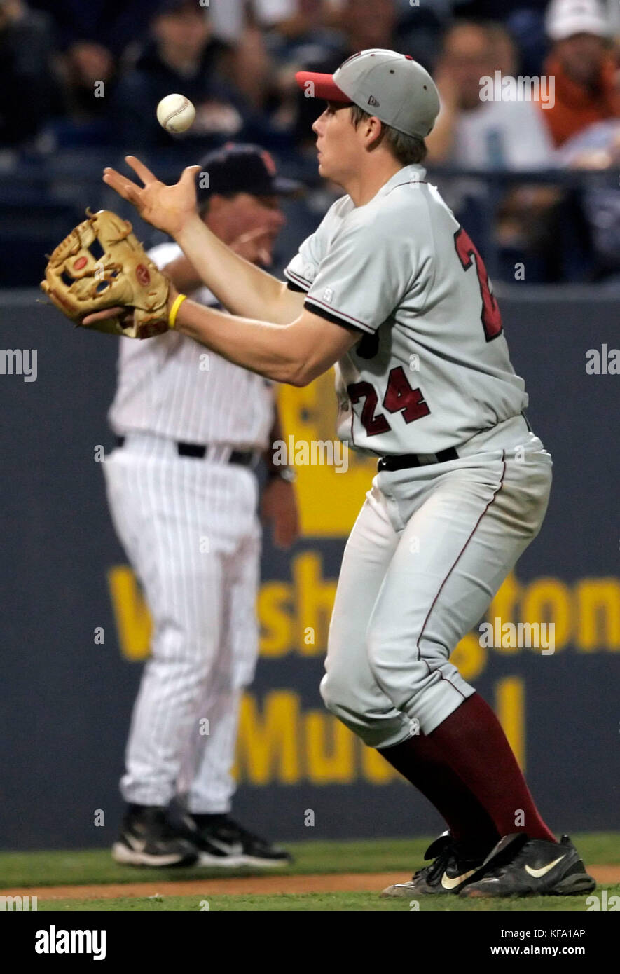 Harvard's third baseman Steffan Wilson bobbles a ball hit by Fullerton ...
