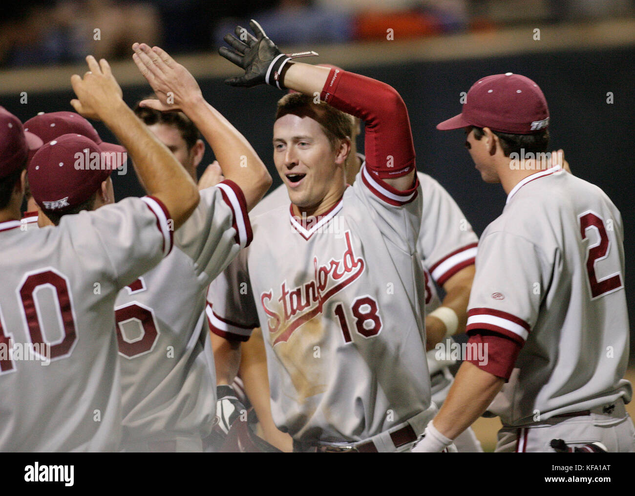 Stanford's Sean Ratliff (18) gets greeted at home after hitting a home ...