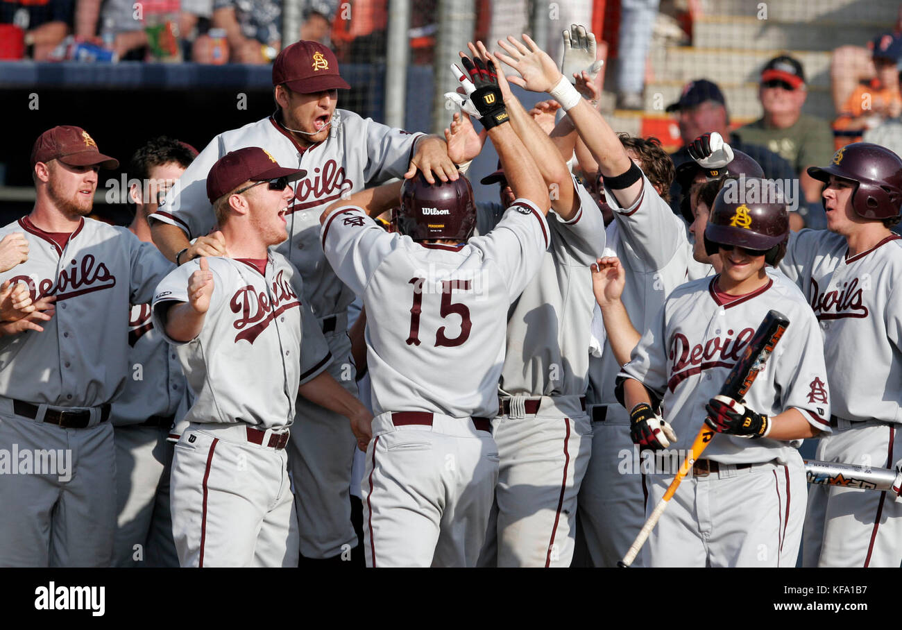 Arizona State's Joe Persichina (15) is mobbed at homeplate by teammates ...