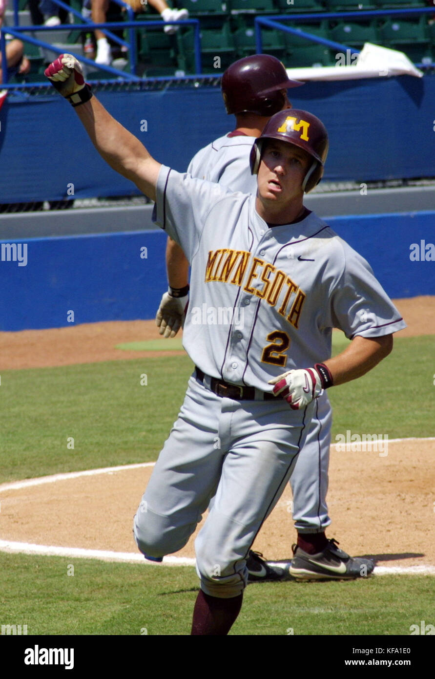 Minnesota's Scott Welch pumps his fist as he scores a run in the ninth ...