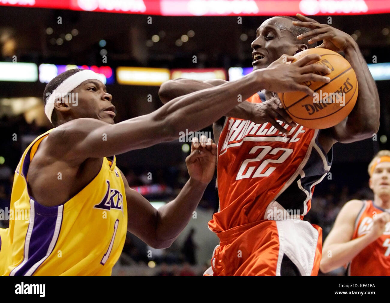 Los Angeles Lakers' Smush Parker, left, fouls Charlotte Bobcats' Brevin ...