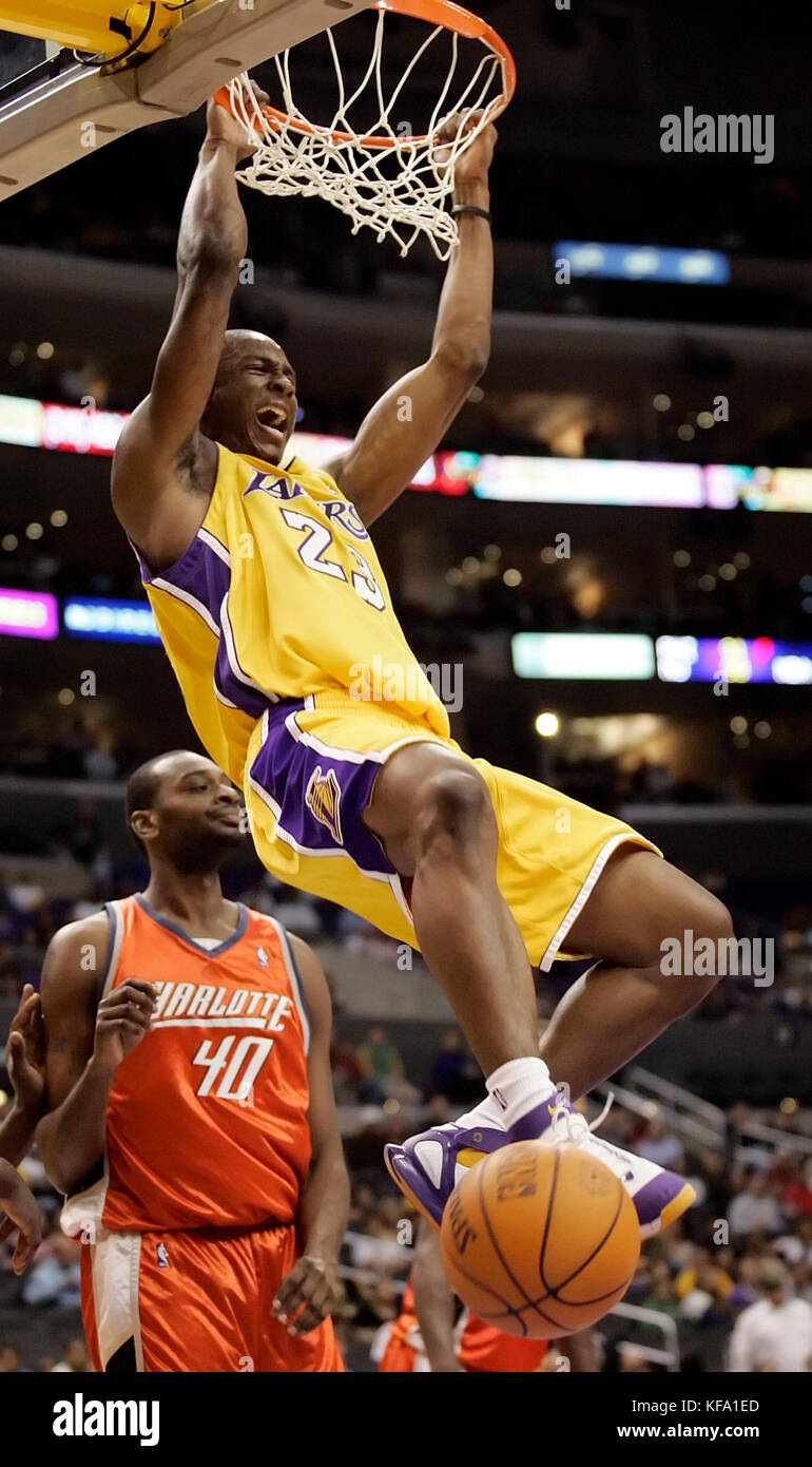 Los Angeles Lakers' Von Wafer, right, hangs onto to the basket after ...