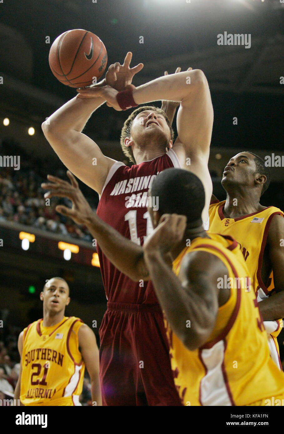 Washington State's Aron Baynes (11) loses the ball while defended by ...