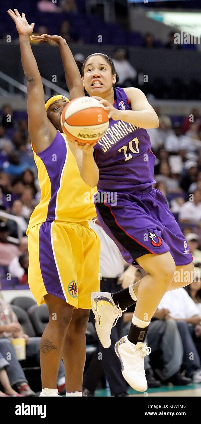 Sacramento Monarchs' Kara Lawson, right, shoots while guarded by Los ...