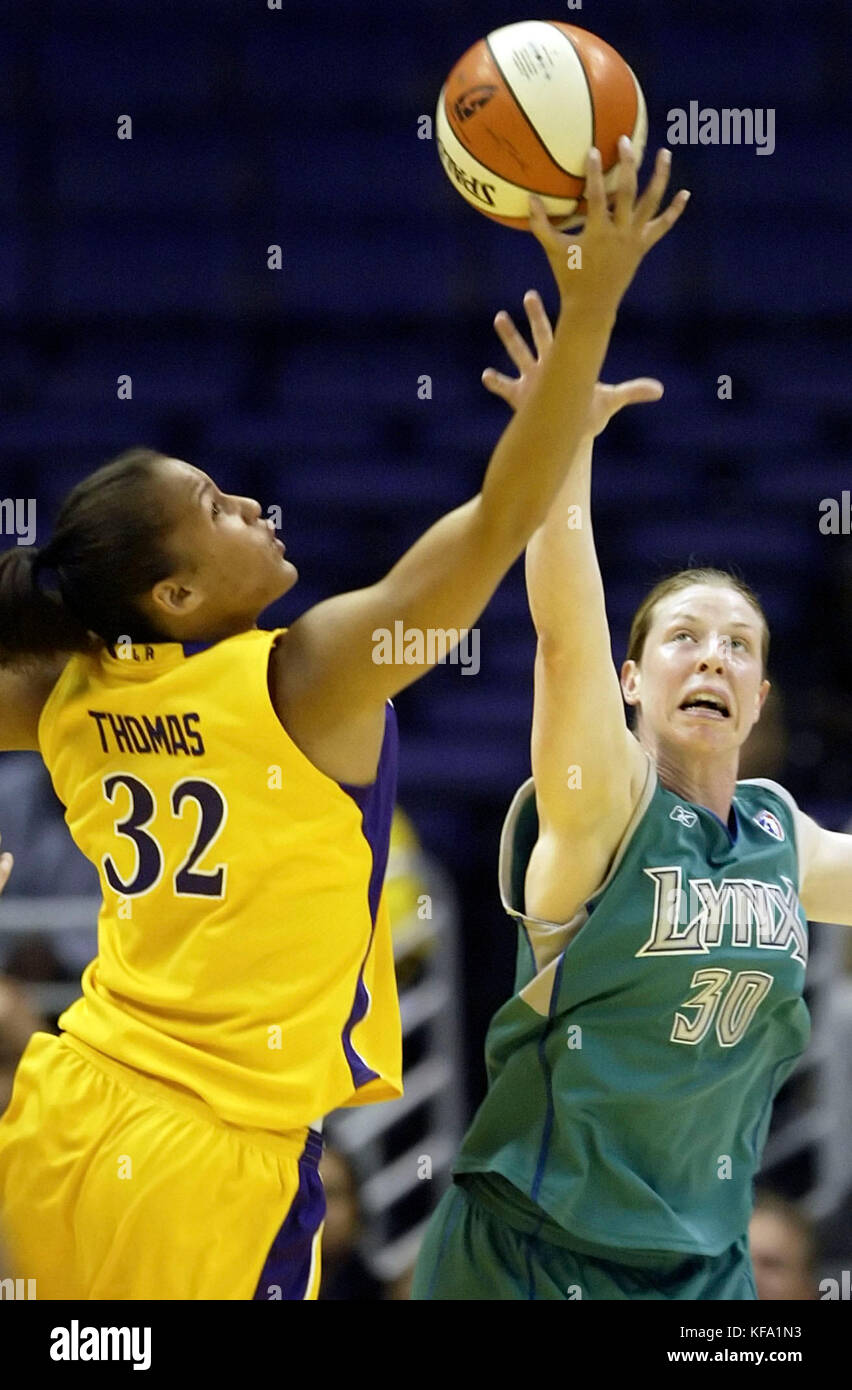 Los Angeles Sparks' Christi Thomas, left, and Minnesota Lynx's Katie ...