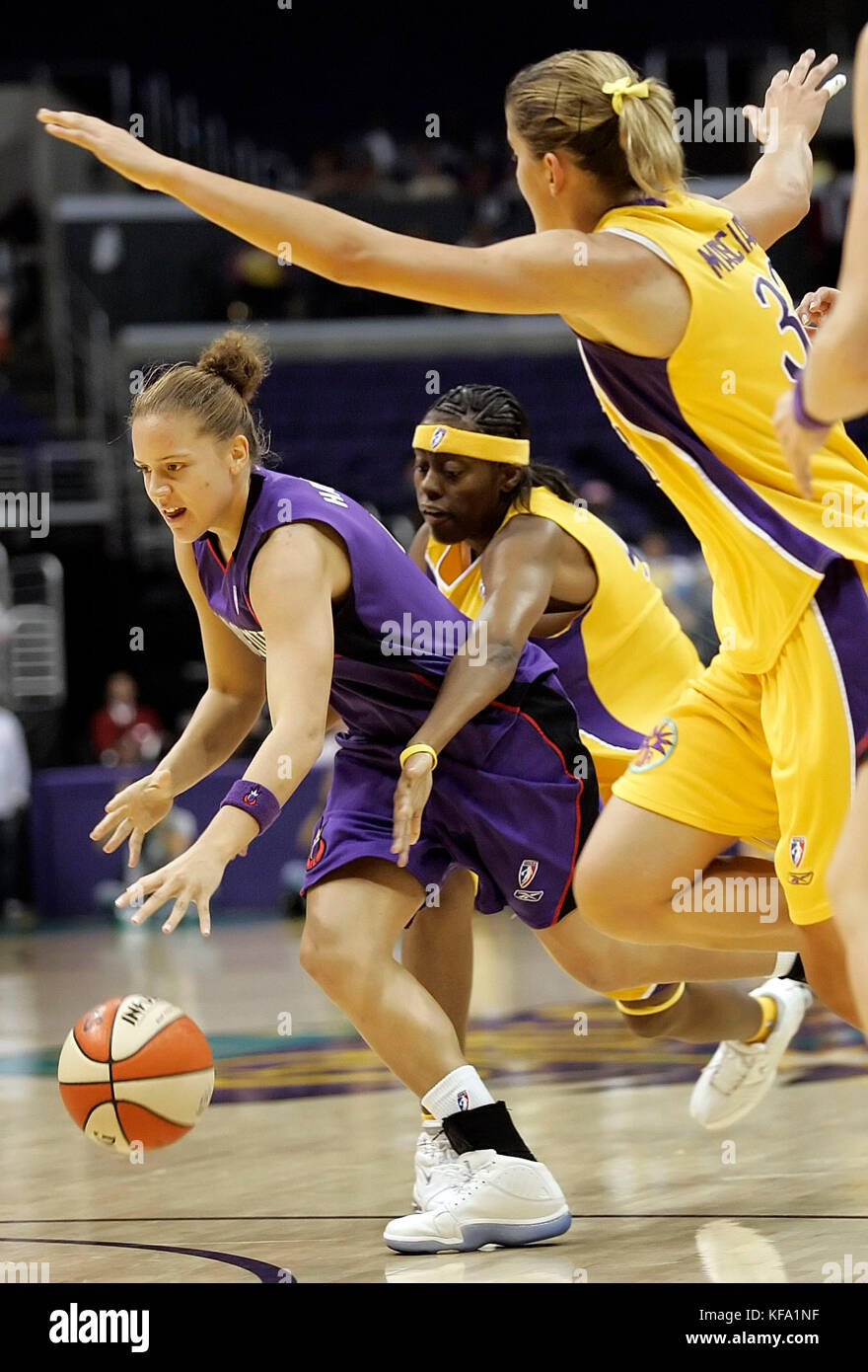 Sacramento Monarchs' Kristin Haynie, left, dribbles the ball upcourt ...