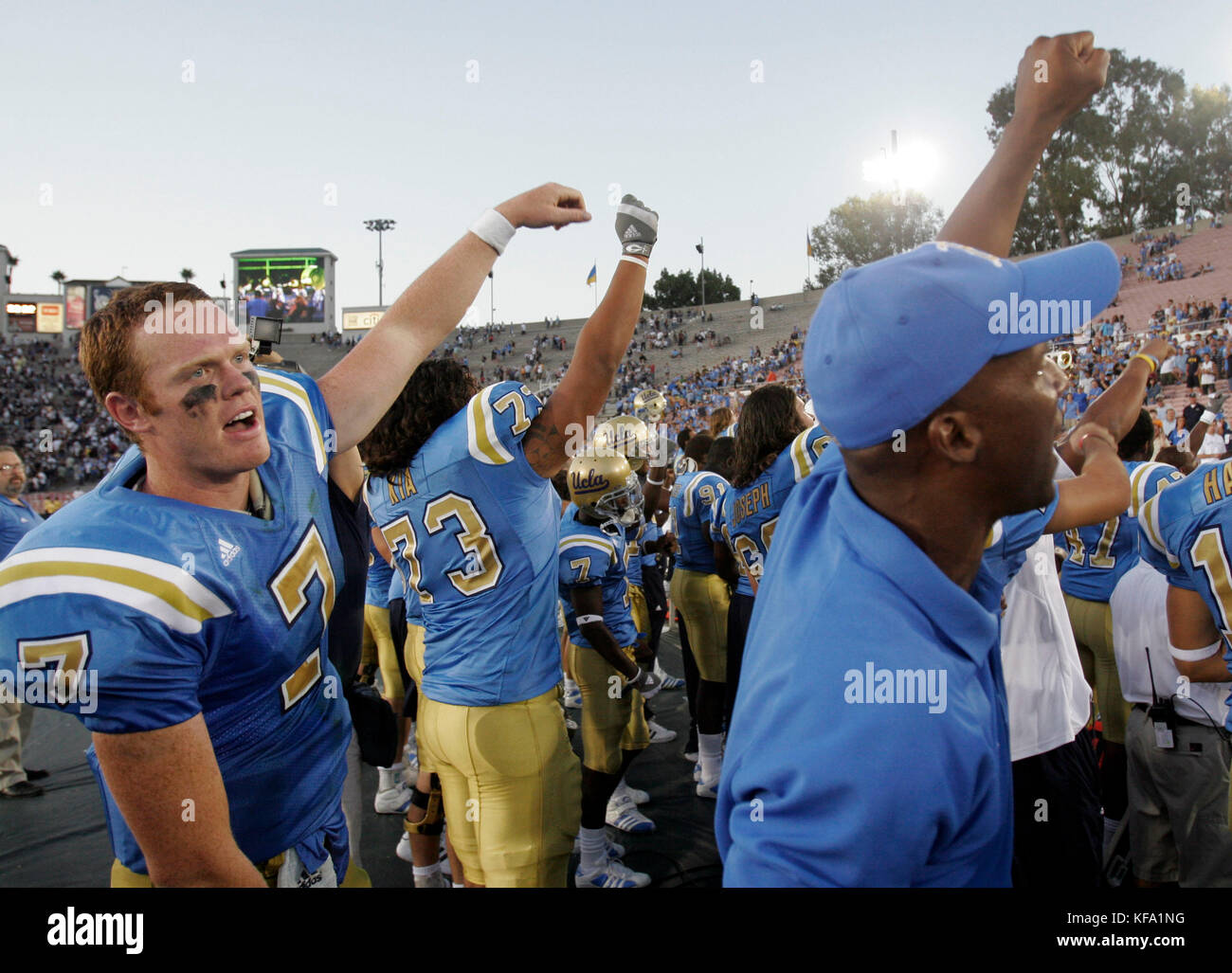 UCLA quarterback Ben Olson, left, and head coach Karl Dorrell, right ...