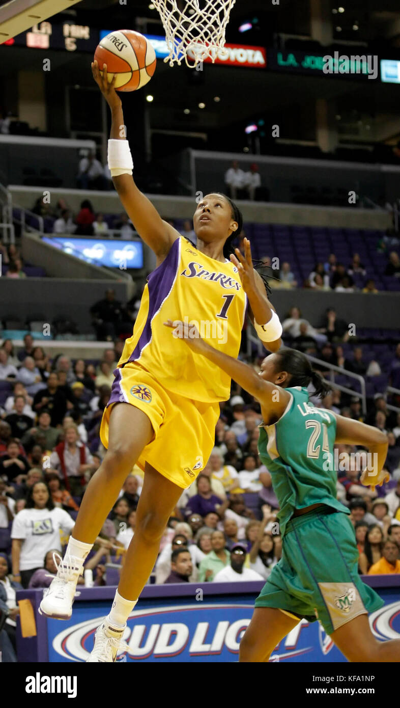 Los Angeles Sparks' Chamique Holdsclaw, left, lays the ball into the ...