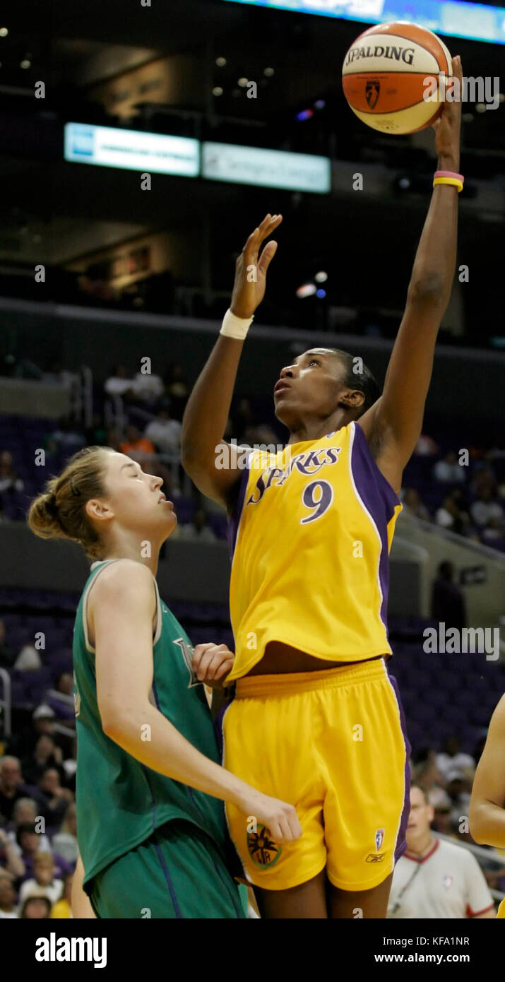 Los Angeles Sparks' Lisa Leslie, right, shoots over Minnesota Lynx's ...