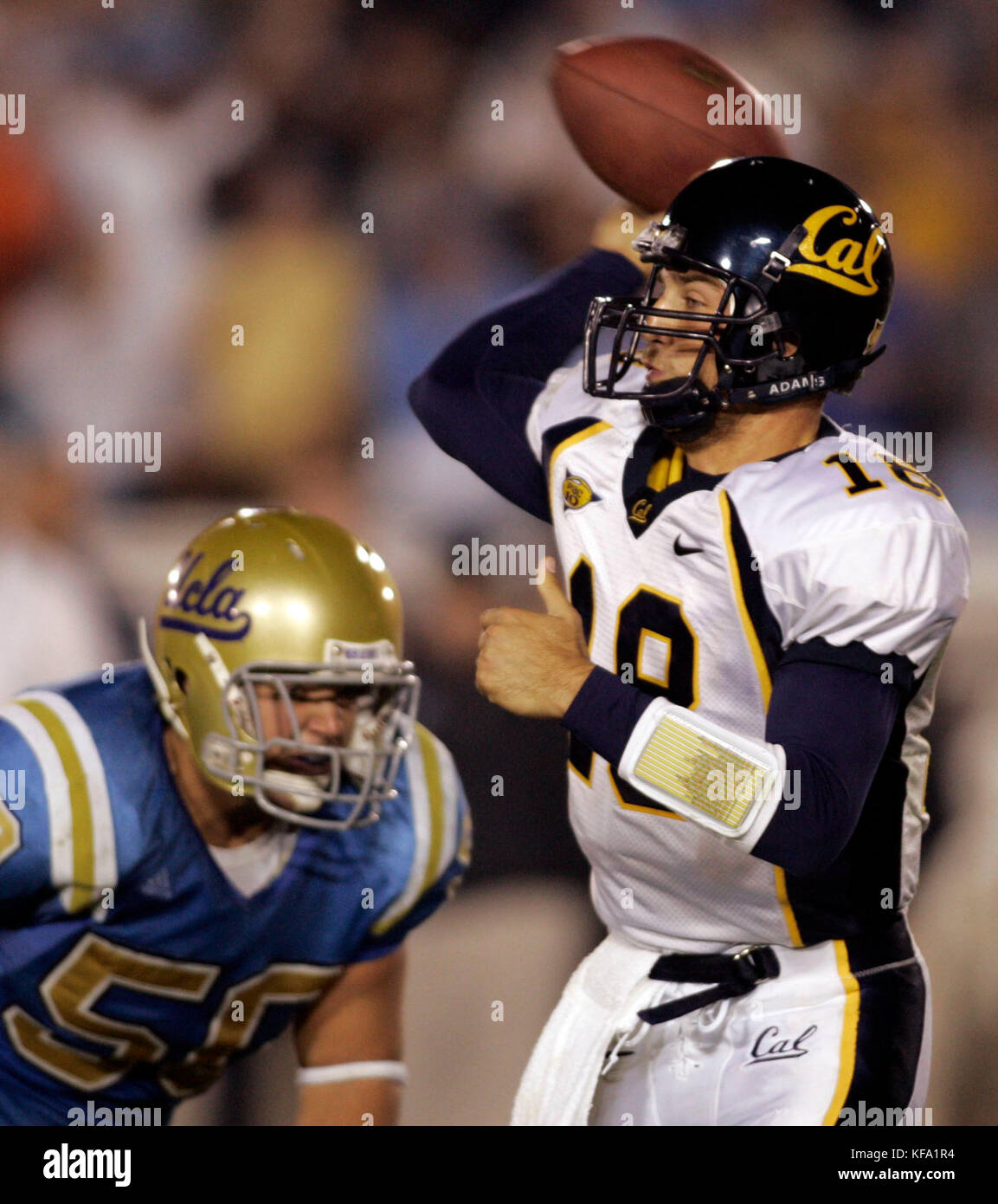 California quarterback Joe Ayoob, right, is pressured by UCLA's Chase ...