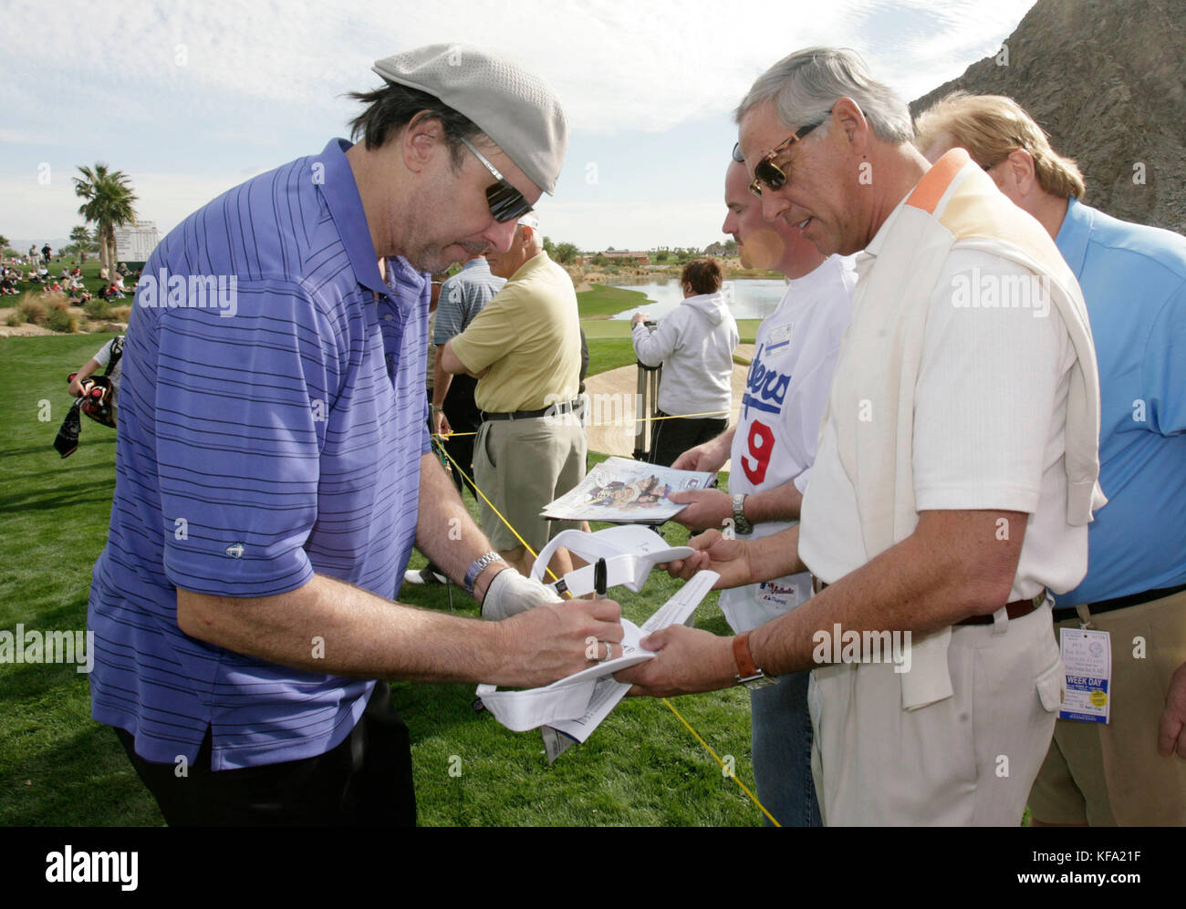 Actor Kevin Nealon signs autographs at the Bob Hope Chrysler Classic at ...