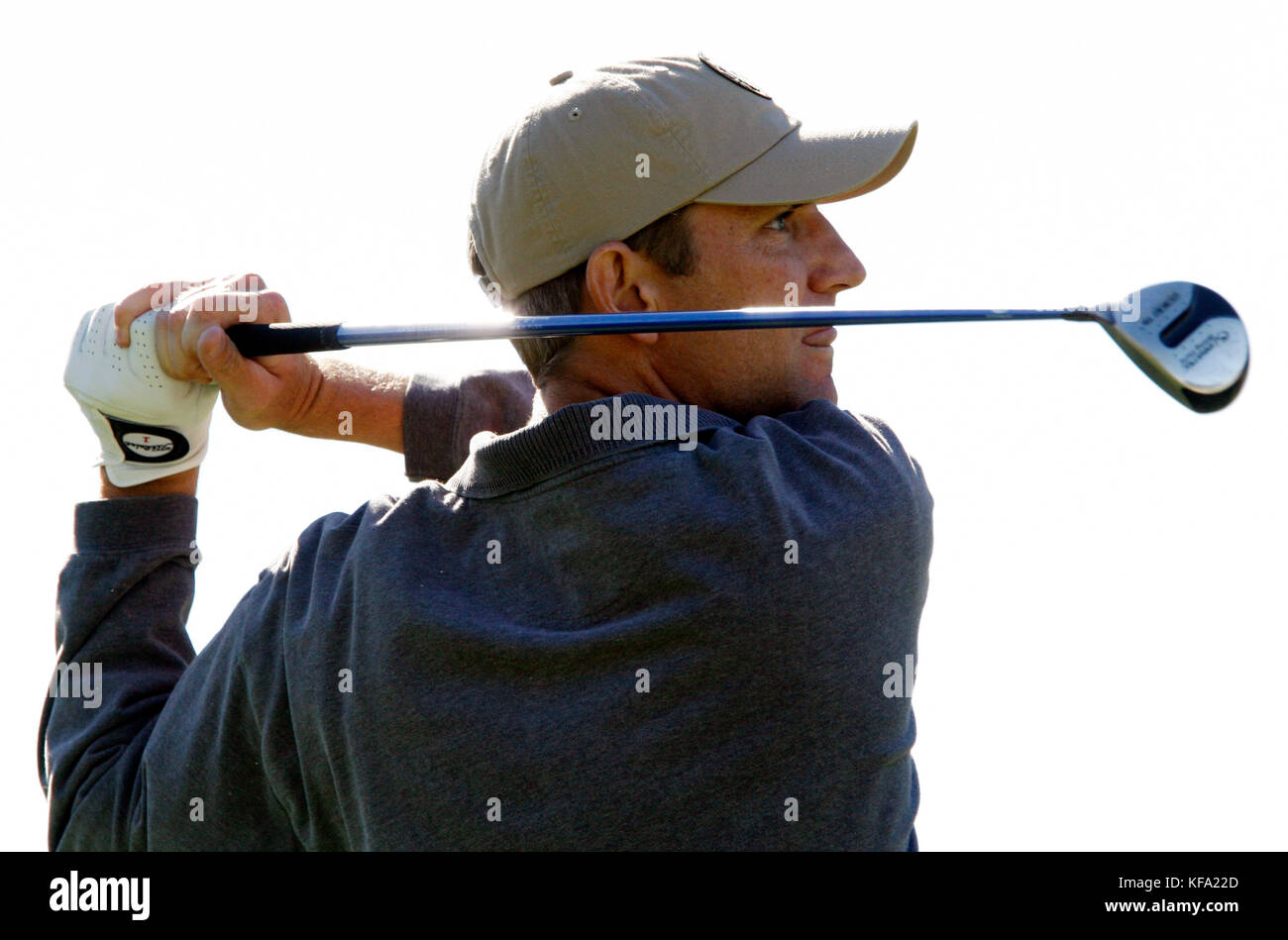 George McNeill watches his shot from the 18th tee of PGA West's ...