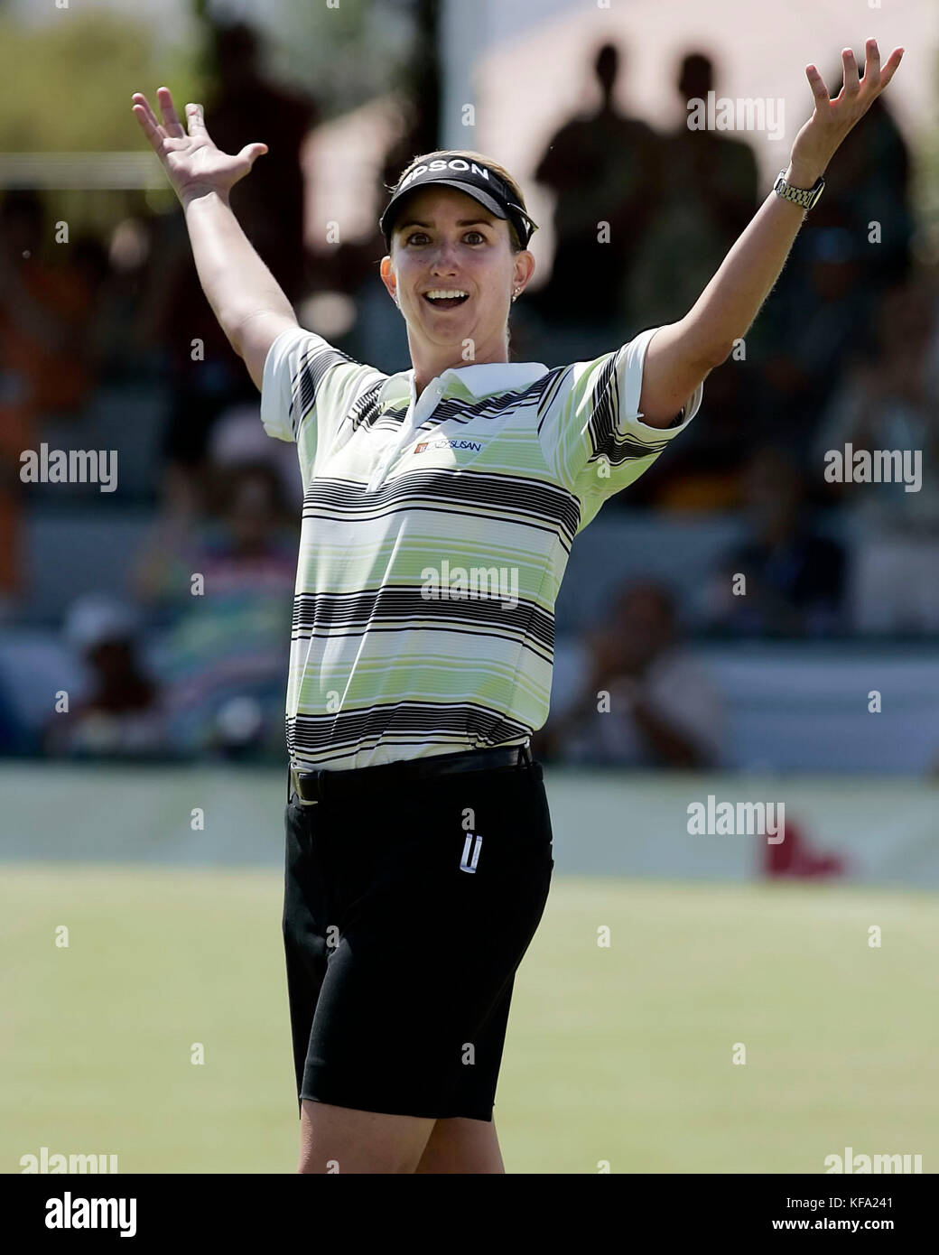 Karrie Webb of Australia raises her arms to the gallery after she ...