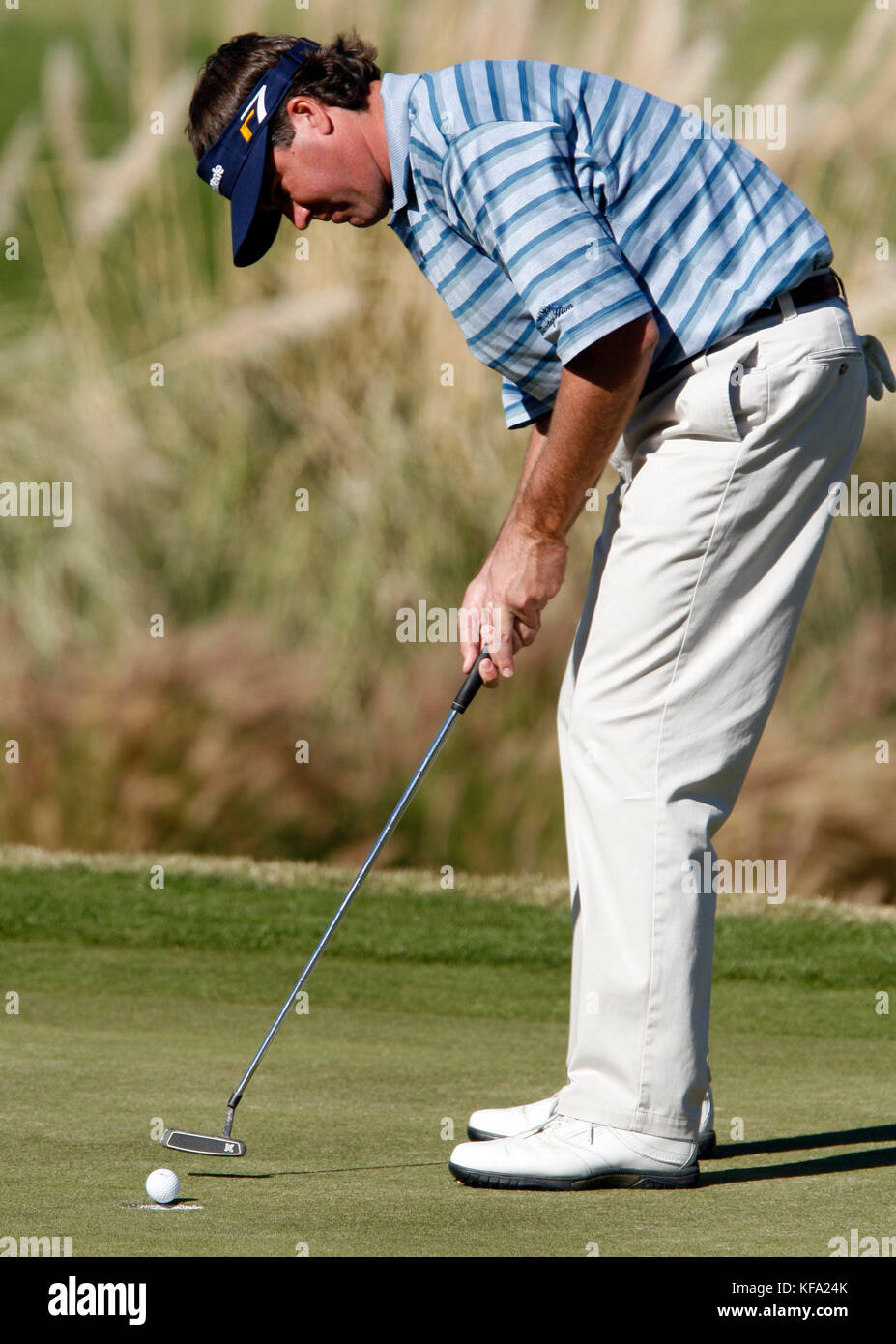 Brent Geiberger makes a putt for par on the 11th hole of PGA West's ...
