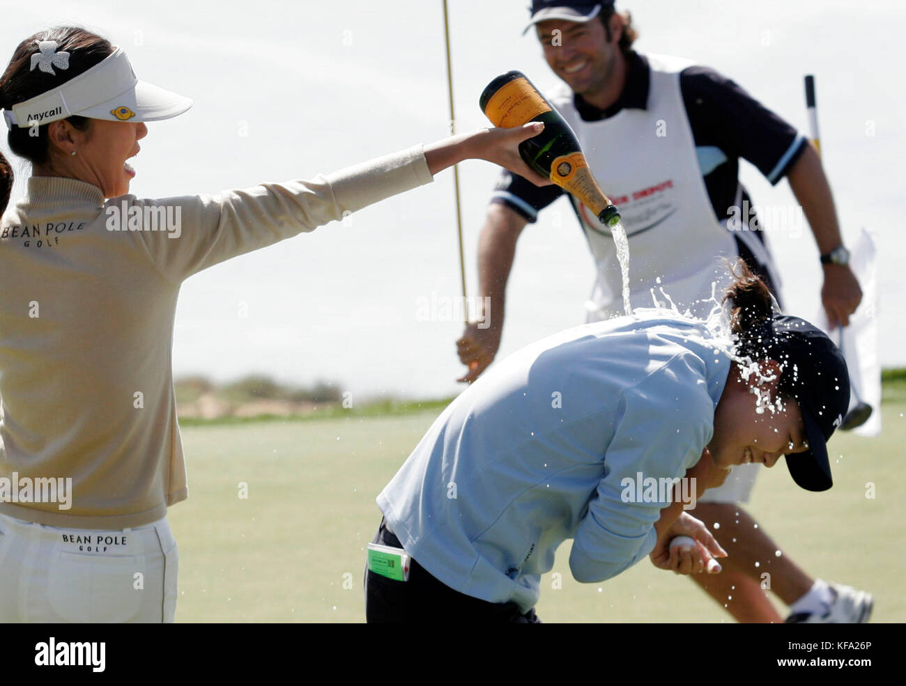 Hee-Won Han of South Korea, right, is doused with champagne by ...
