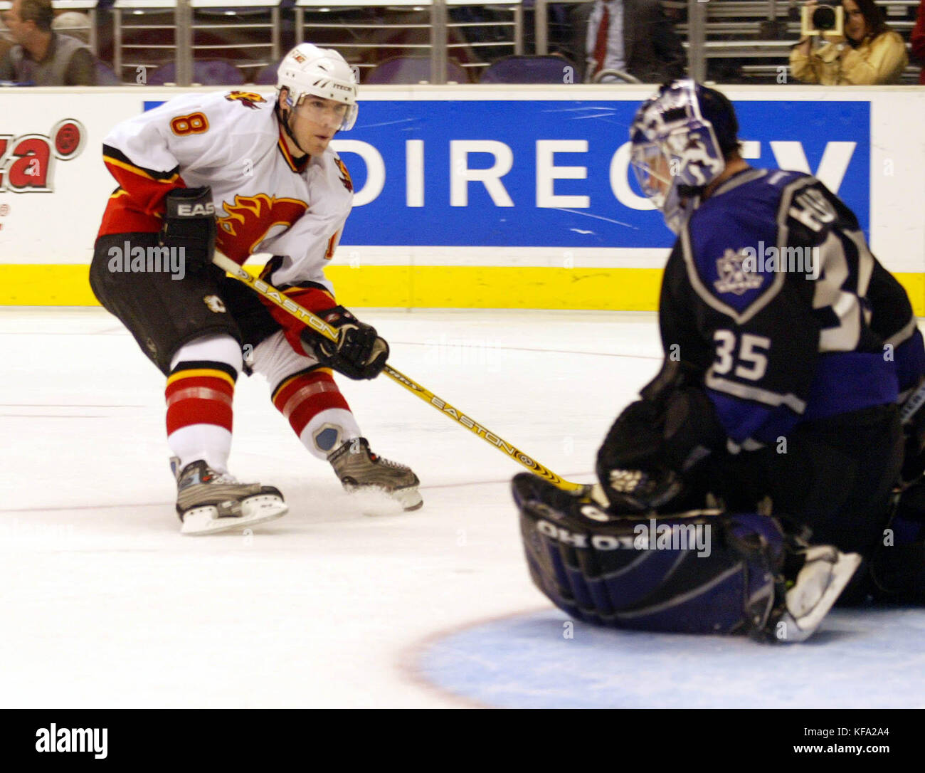 Calgary Flames Matthew Lombardi, left, shoots the puck past Los Angeles ...