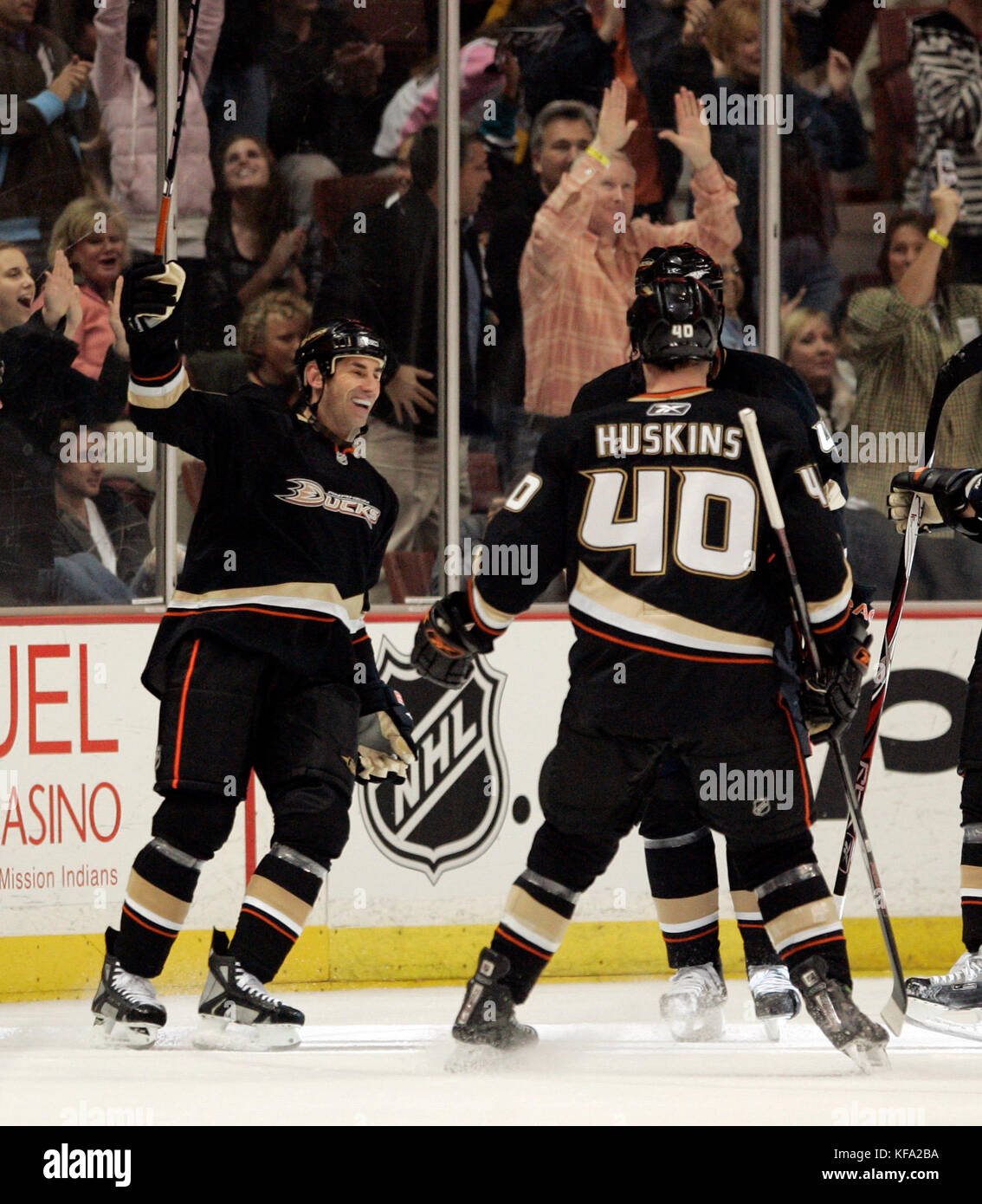 Anaheim Ducks' Mathieu Schneider, left, celebrates with teammate Kent ...