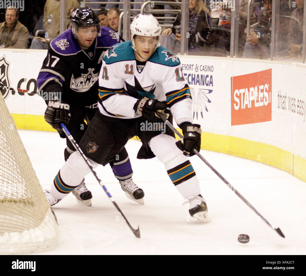 San Jose Sharks' Marcel Goc, right, passes the puck from behind the net ...