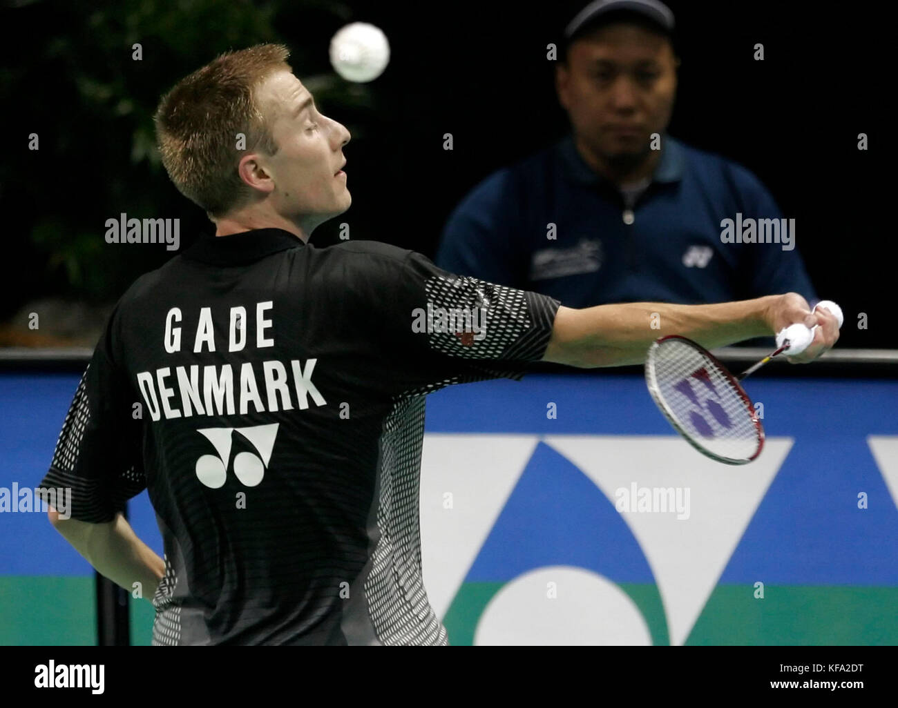 Peter Gade of Denmark hits a backhand shot against Pedro Yang of ...