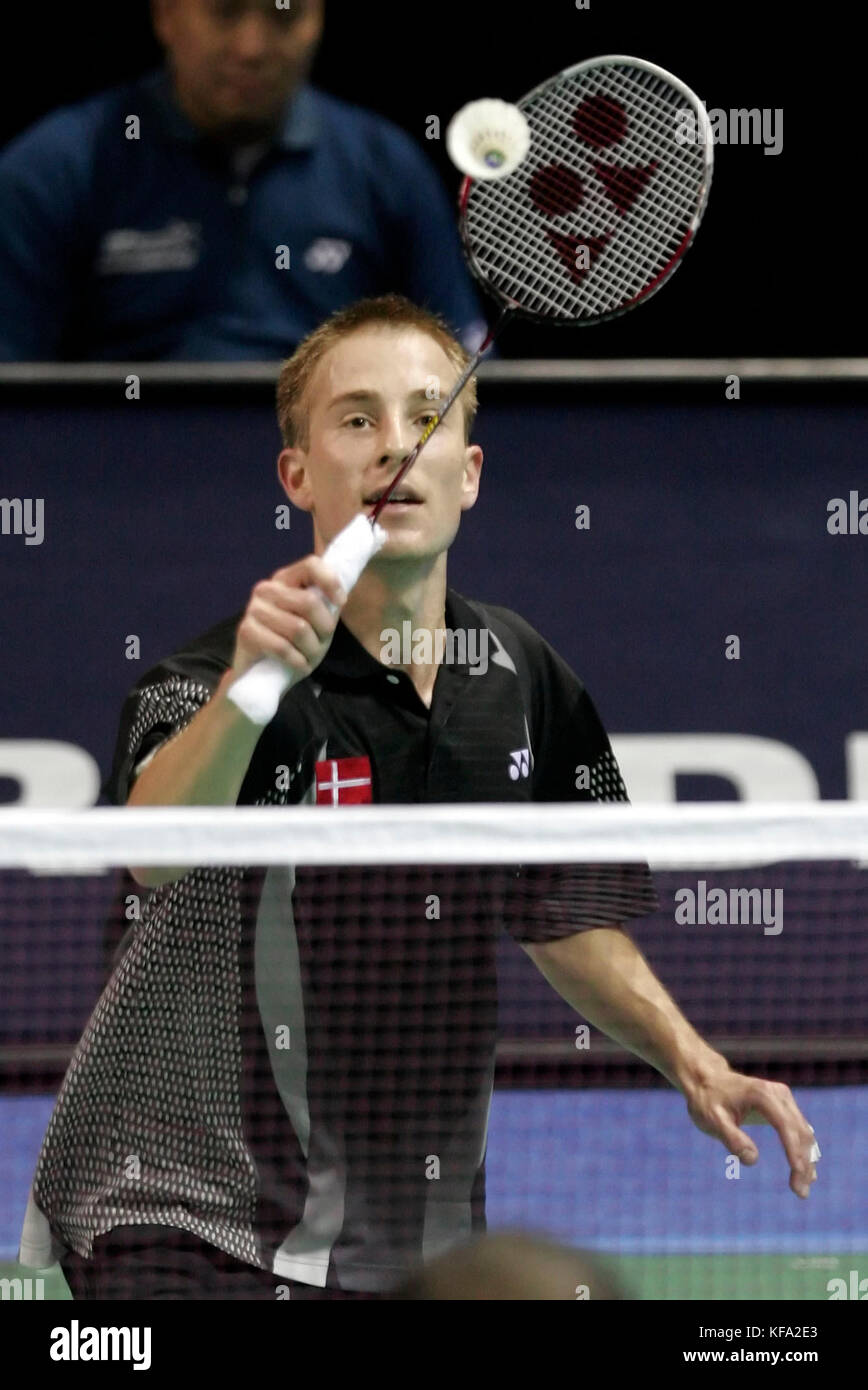Peter Gade of Denmark hits the shuttlecock back over the net in his ...