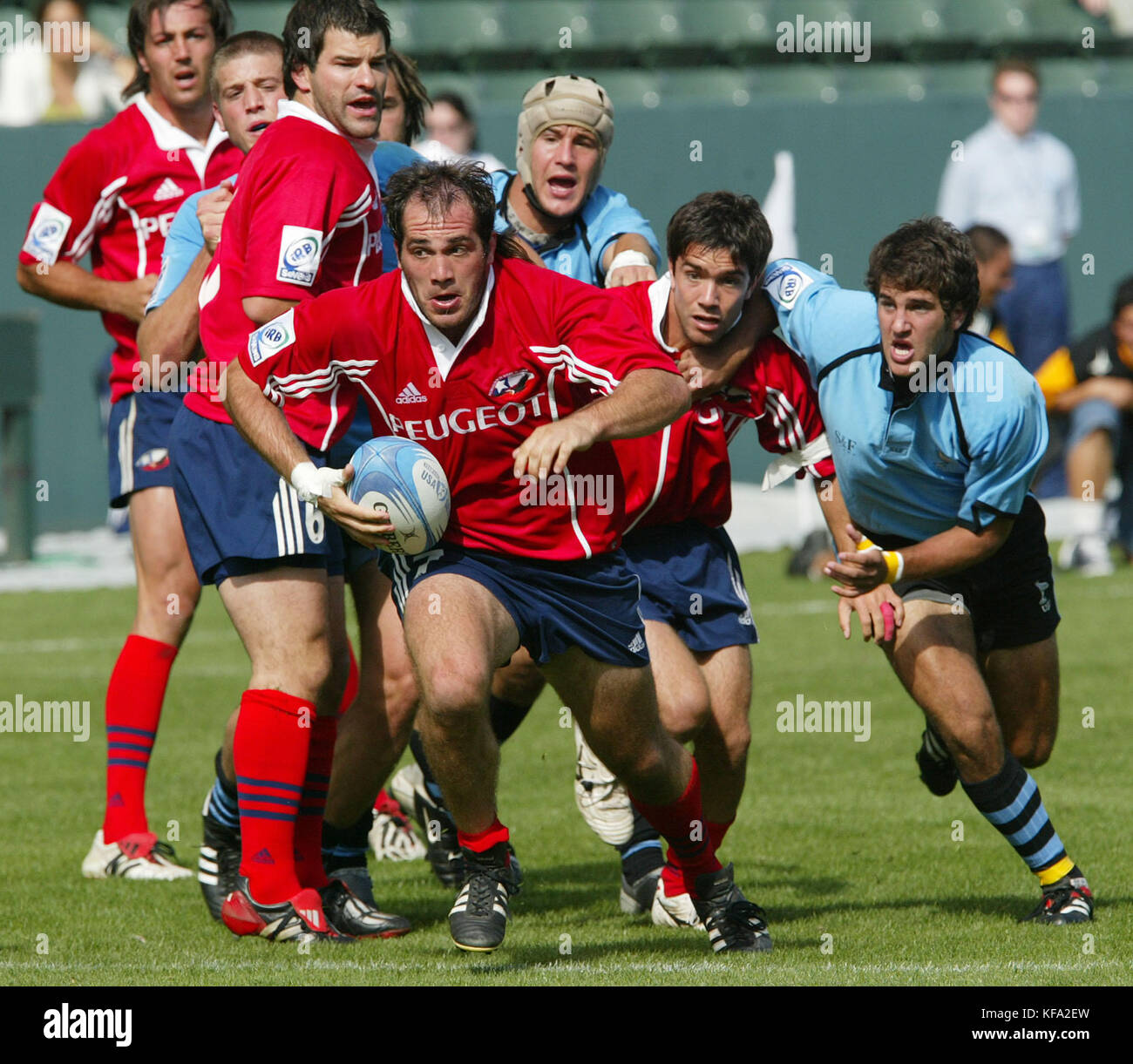 Chile's Cristobal Westenenik, (C) , runs away from a scrum with the ...