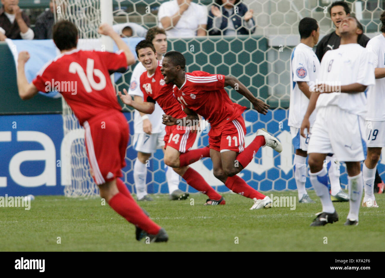 Canada's Tosaint Ricketts (11) celebrates with his teammates, Keegan ...